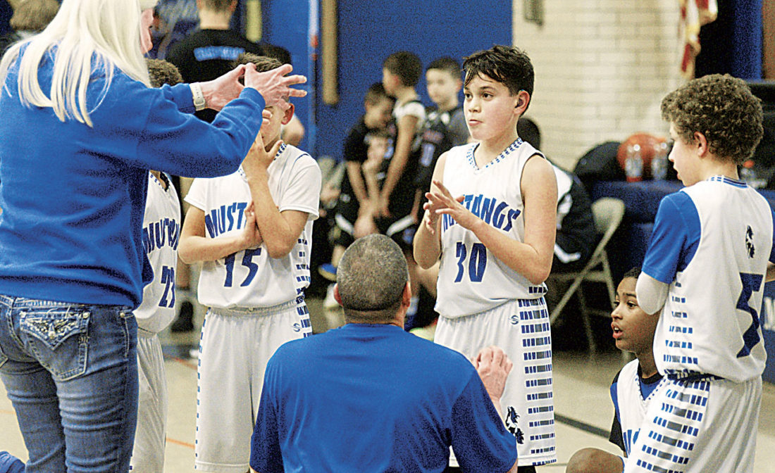 Madison Elementary School basketball player uses interpreter, hearing ...